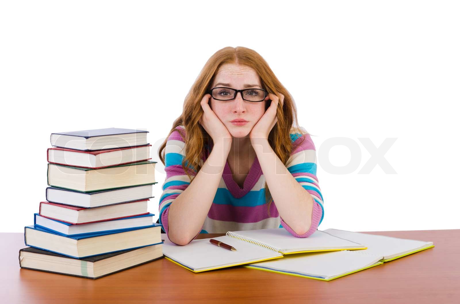 Young student with books isolated on white | Stock image | Colourbox