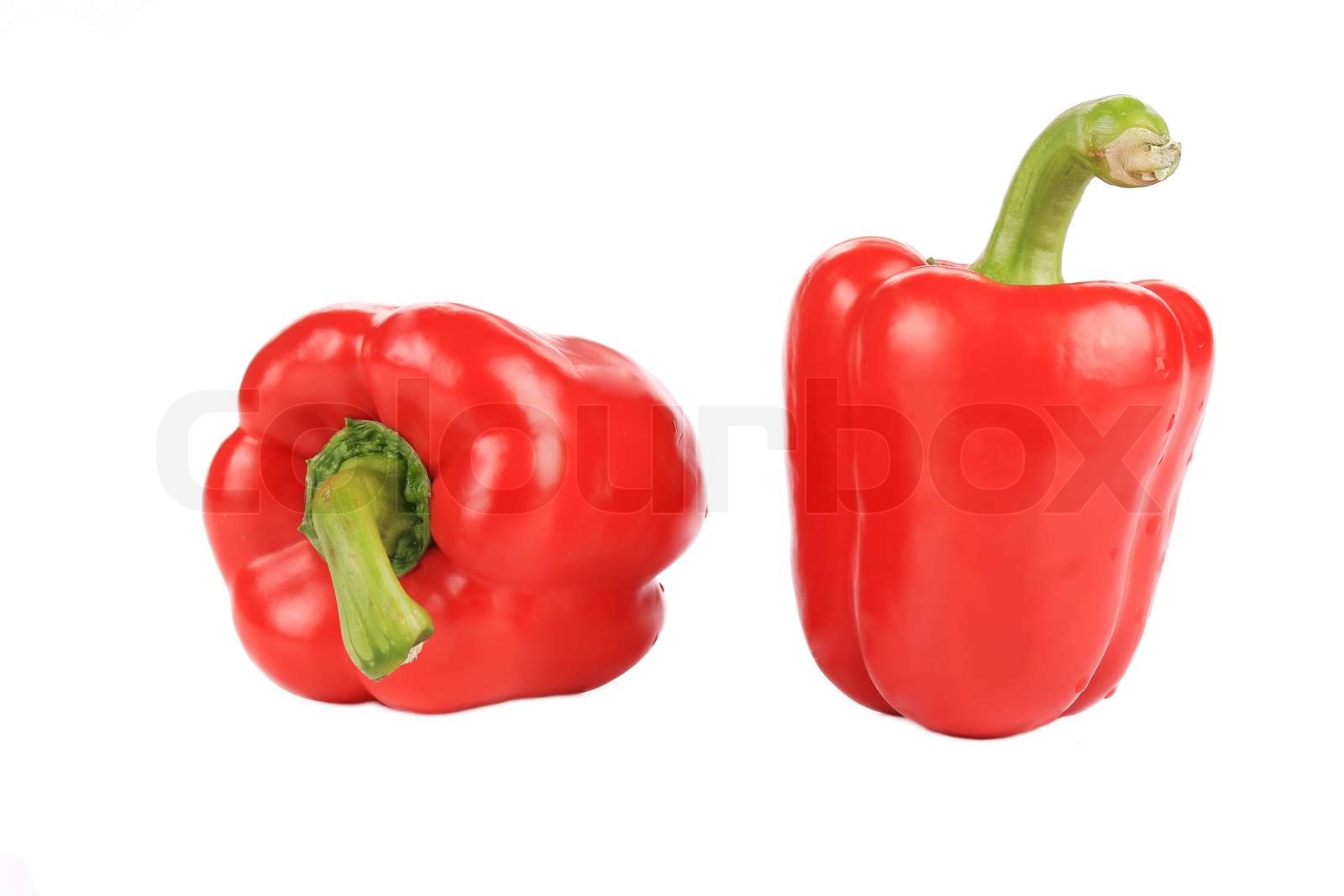Two red sweet bell peppers. | Stock image | Colourbox