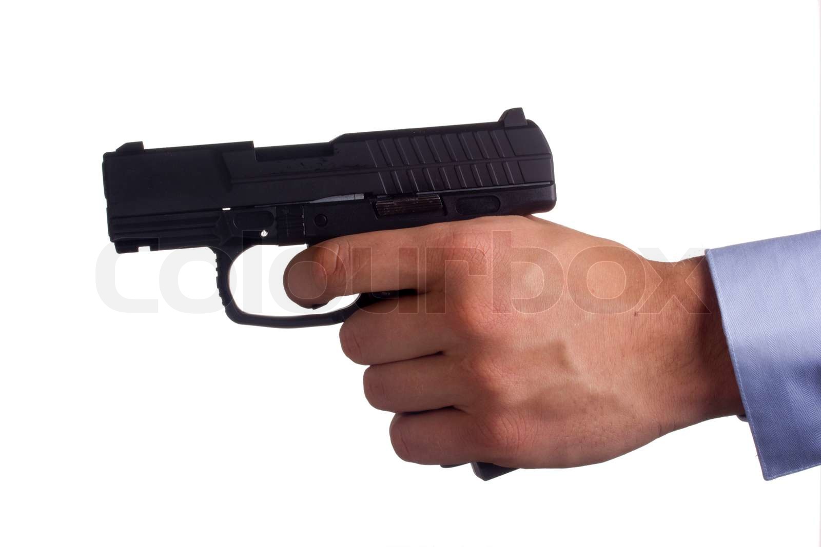 Pistol in hand | Stock image | Colourbox