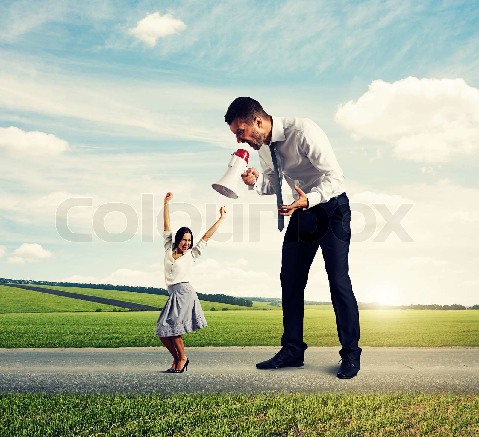 man screaming at happy dancing woman | Stock image | Colourbox