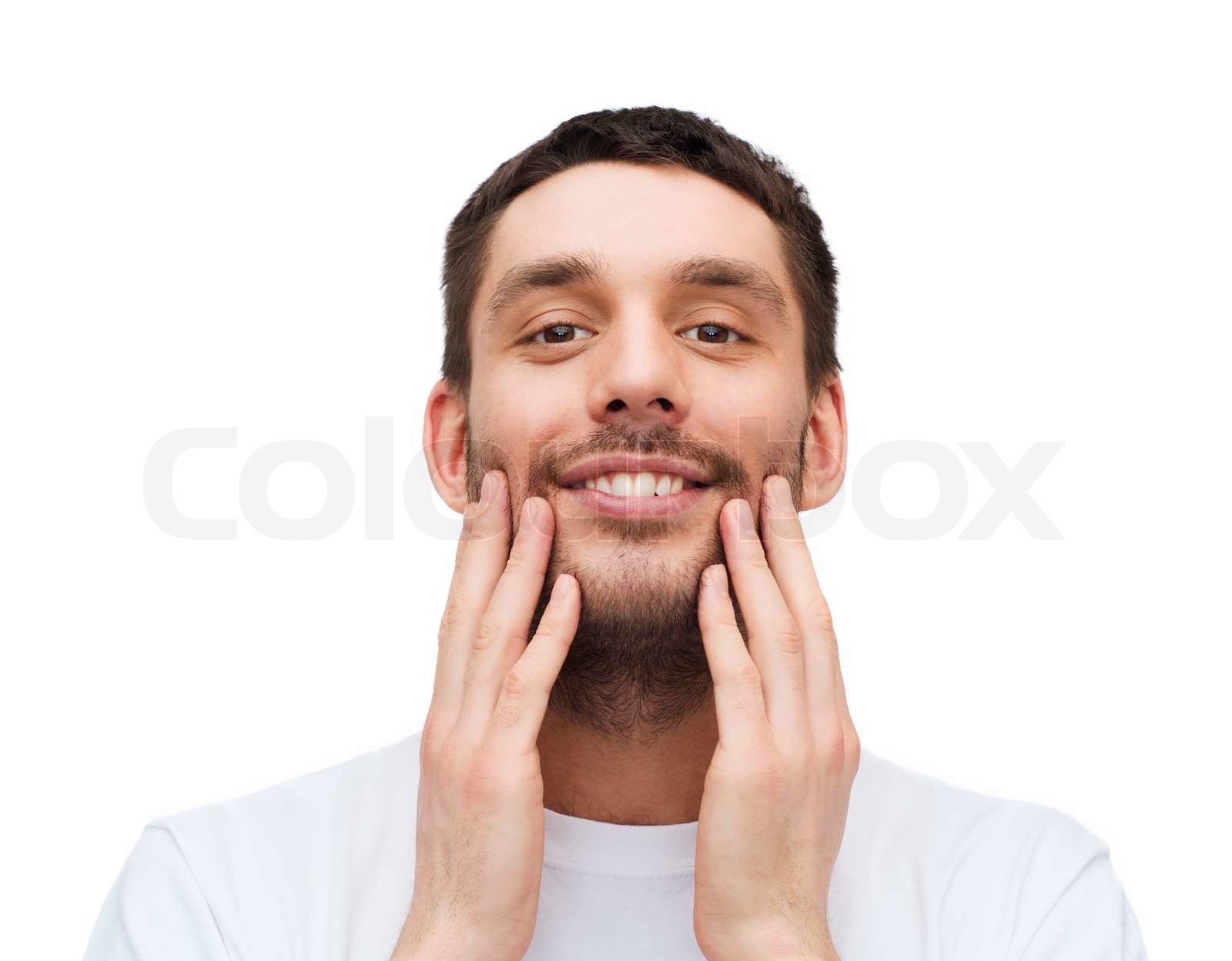 beautiful smiling man touching his face | Stock image | Colourbox