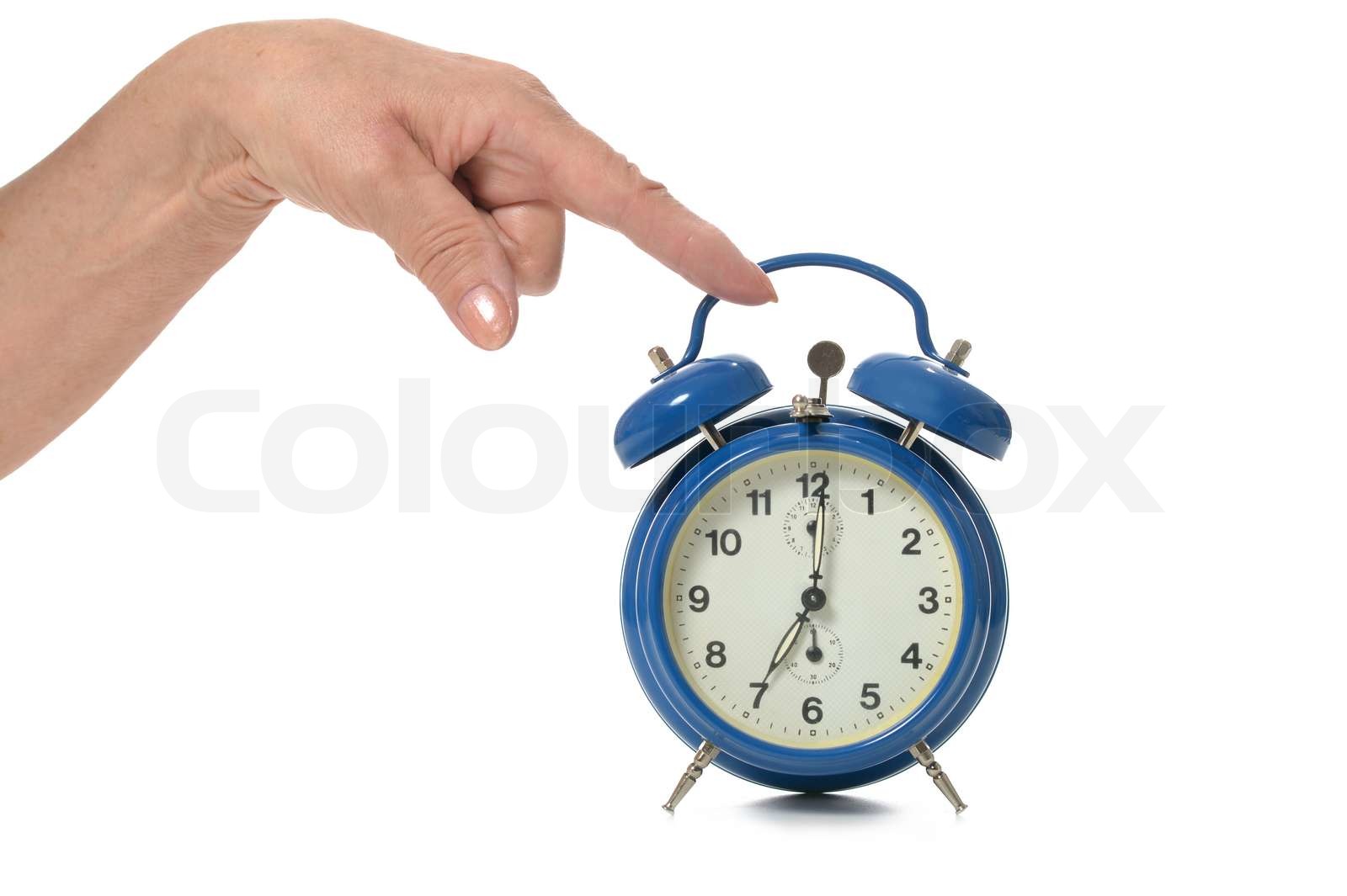 Hand and alarm | Stock image | Colourbox