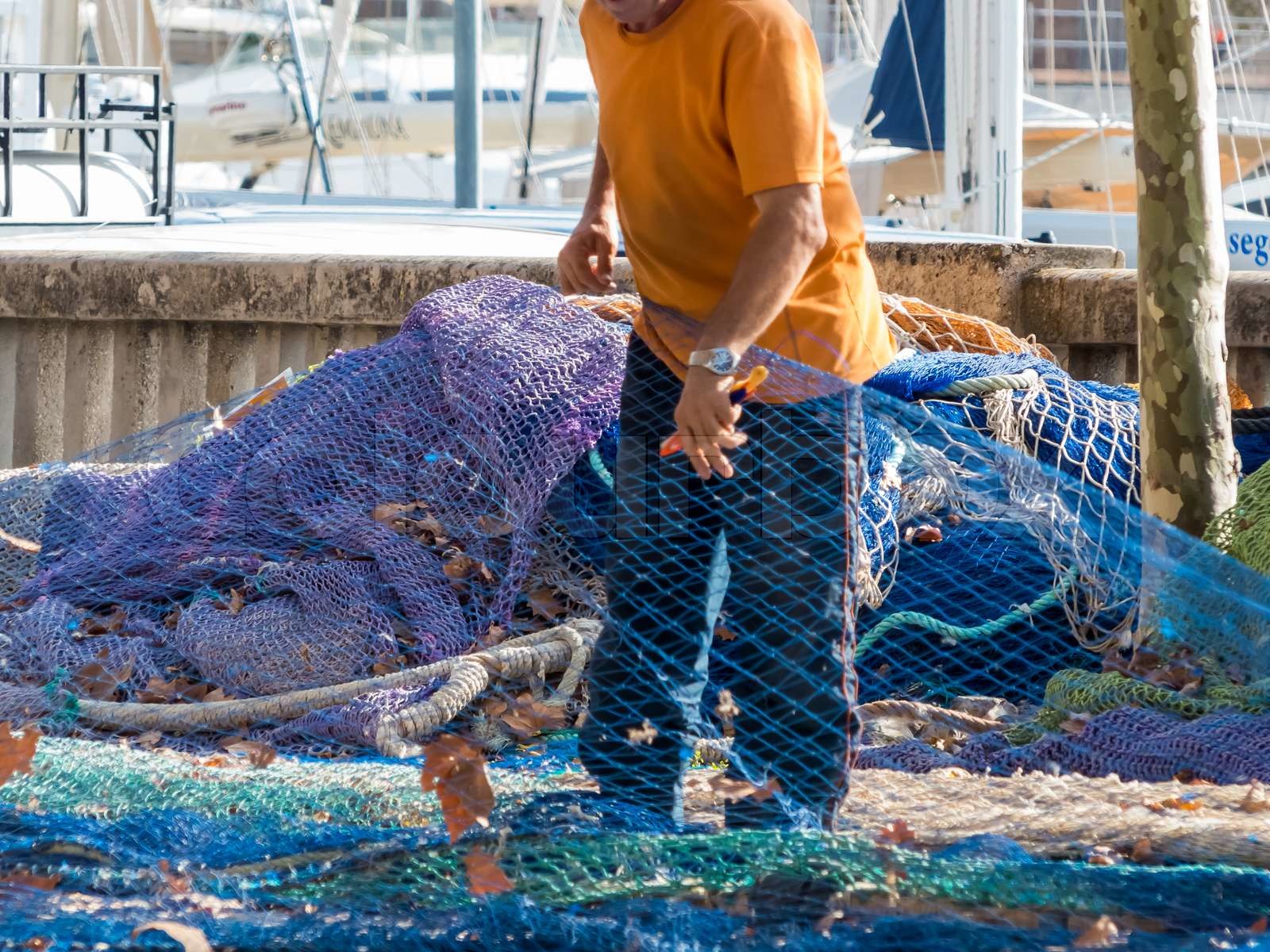 fishing nets repaired | Stock image | Colourbox