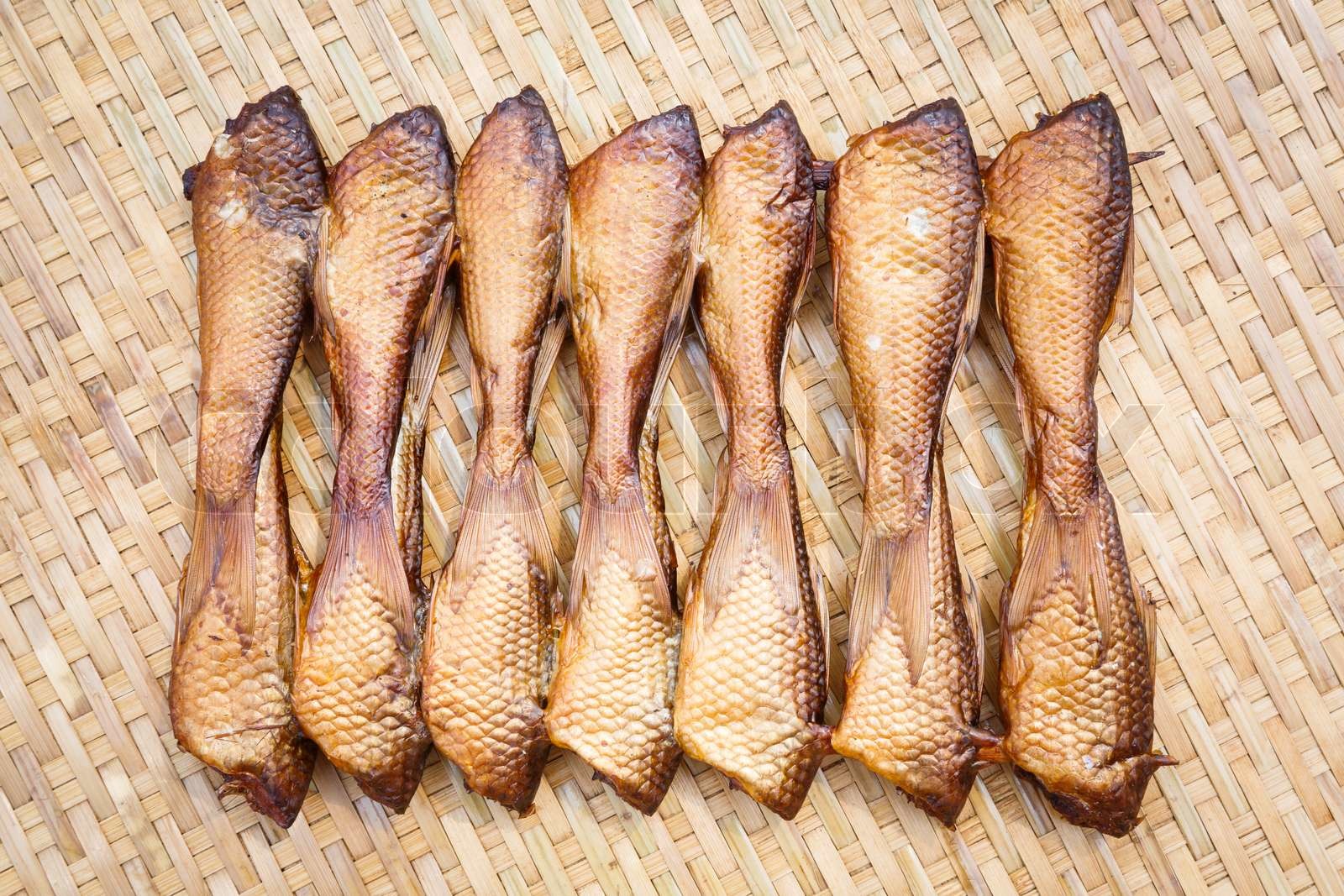 Crispy smoke dried siamese mud carp fish | Stock image | Colourbox