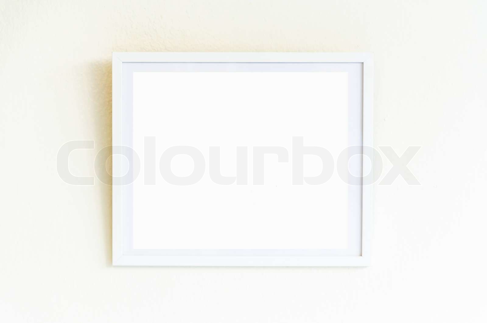 White frame on white wall | Stock image | Colourbox