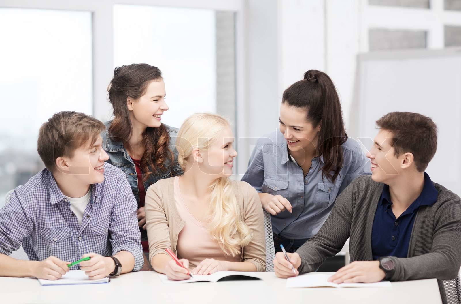 students having discussion at school | Stock image | Colourbox