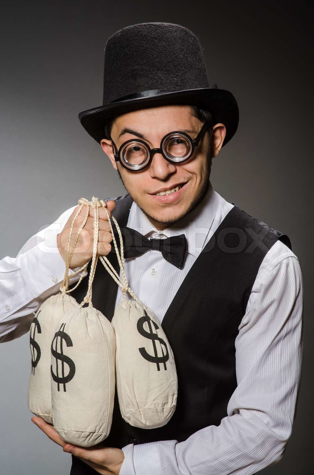 Man with sacks of money | Stock image | Colourbox