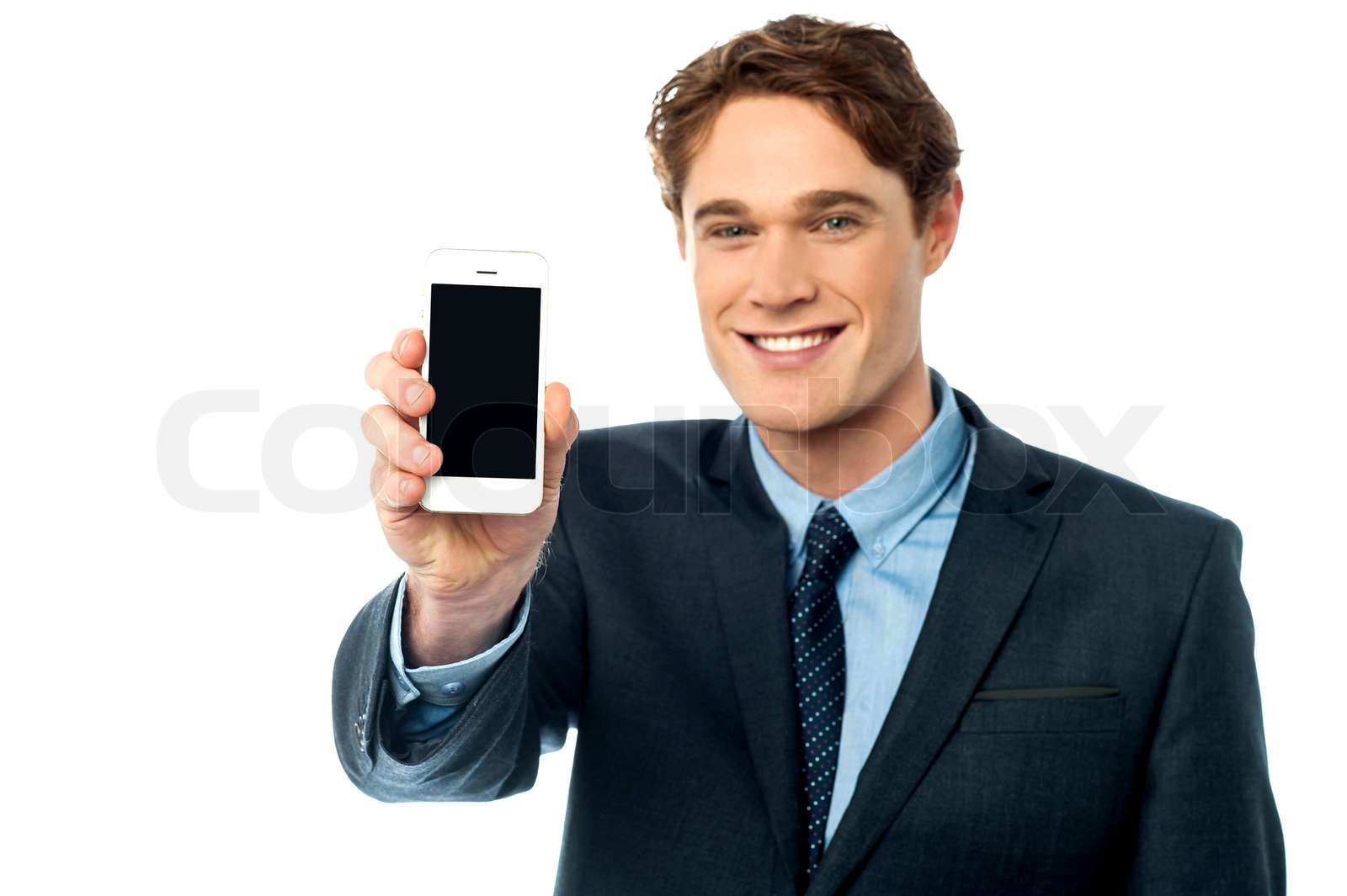 Salesman displaying newly launched mobile | Stock image | Colourbox