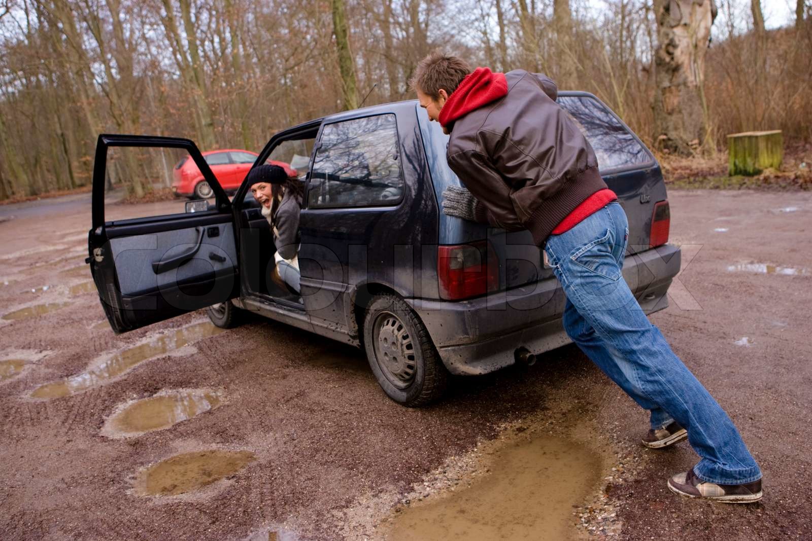 Man Pushing Car