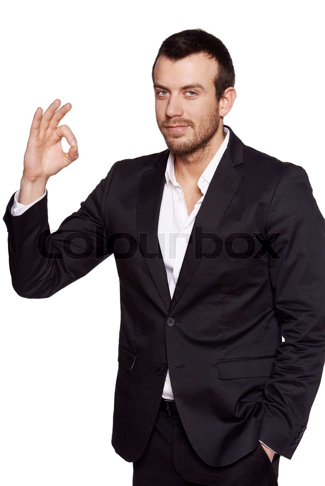Relaxed fashionable man in suit standing casually | Stock image | Colourbox