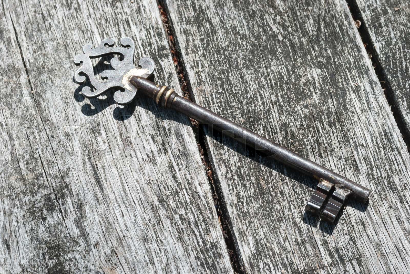 big old key on the wooden table | Stock image | Colourbox