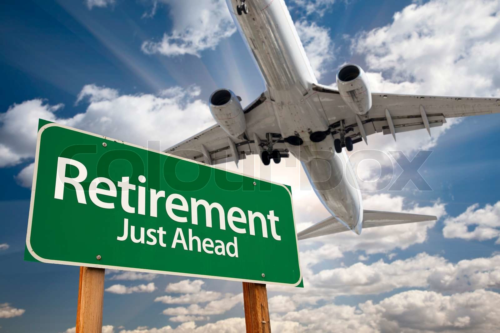 Retirement Green Road Sign and Airplane Above | Stock image | Colourbox