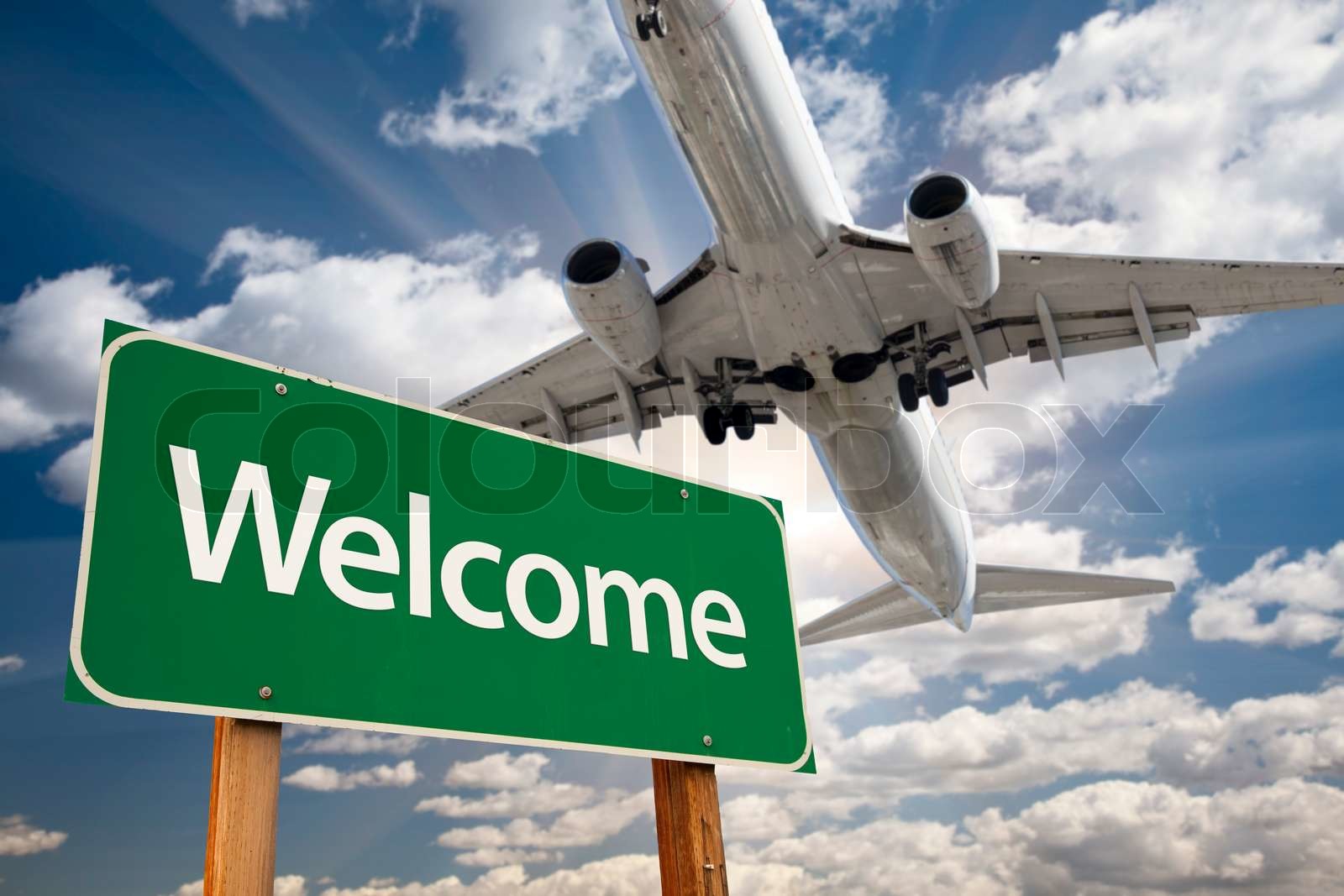 Welcome Green Road Sign and Airplane Above | Stock image | Colourbox