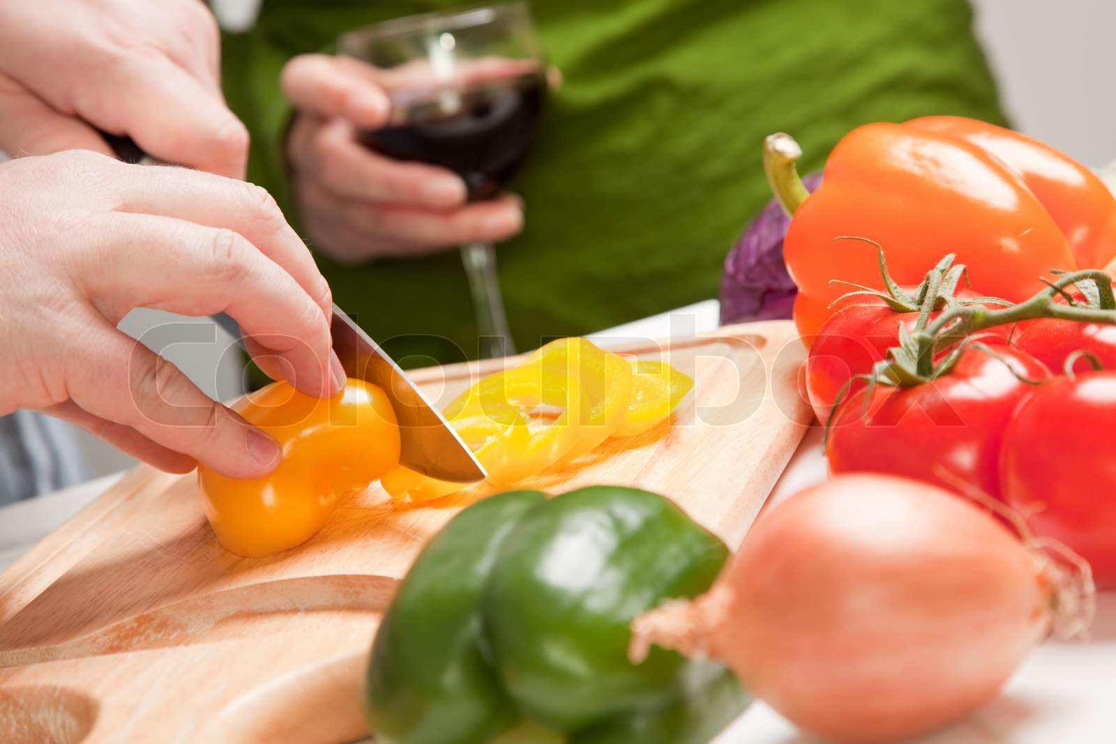 Man Slicing Vegetables | Stock image | Colourbox