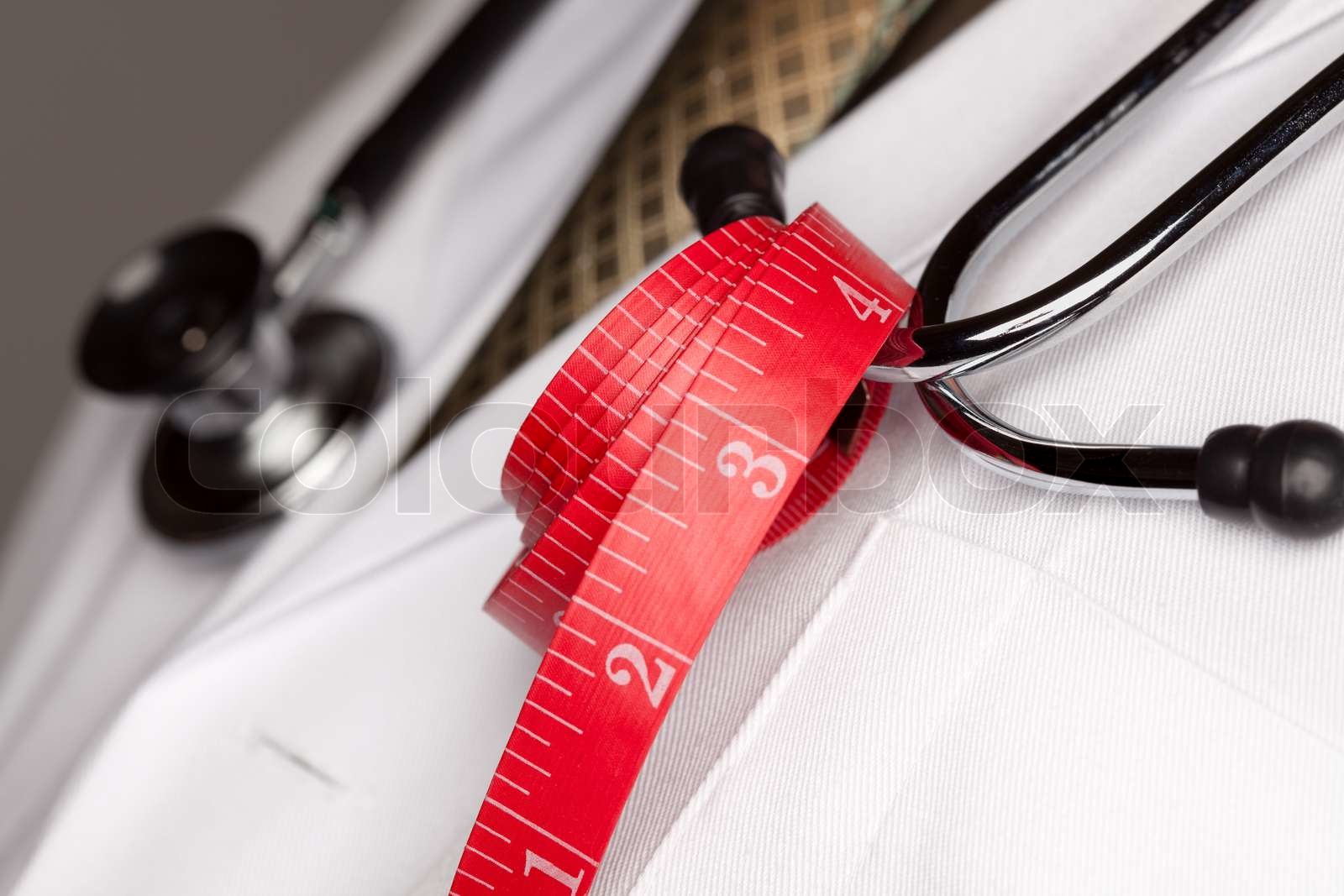 Doctor with Stethoscope and Measuring Tape | Stock image | Colourbox