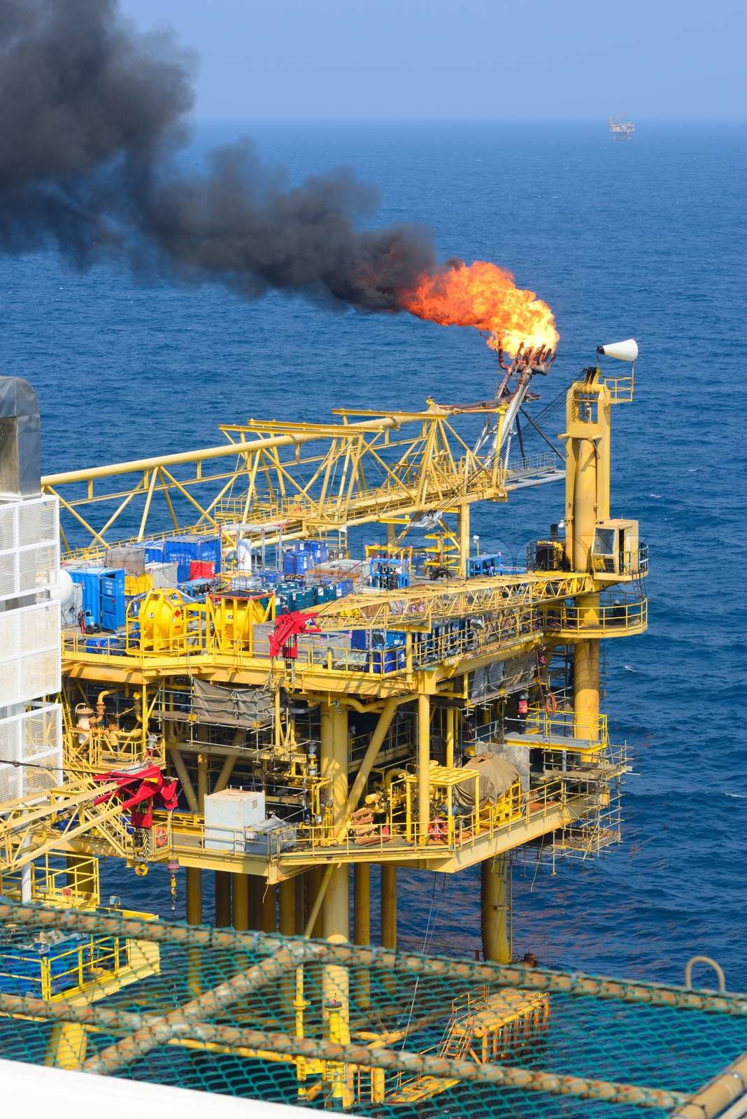 The gas flare is on the offshore oil rig | Stock image | Colourbox