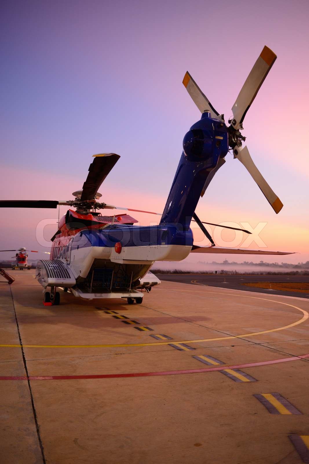 offshore oil rig helicopter in the apron next to runway | Stock image ...
