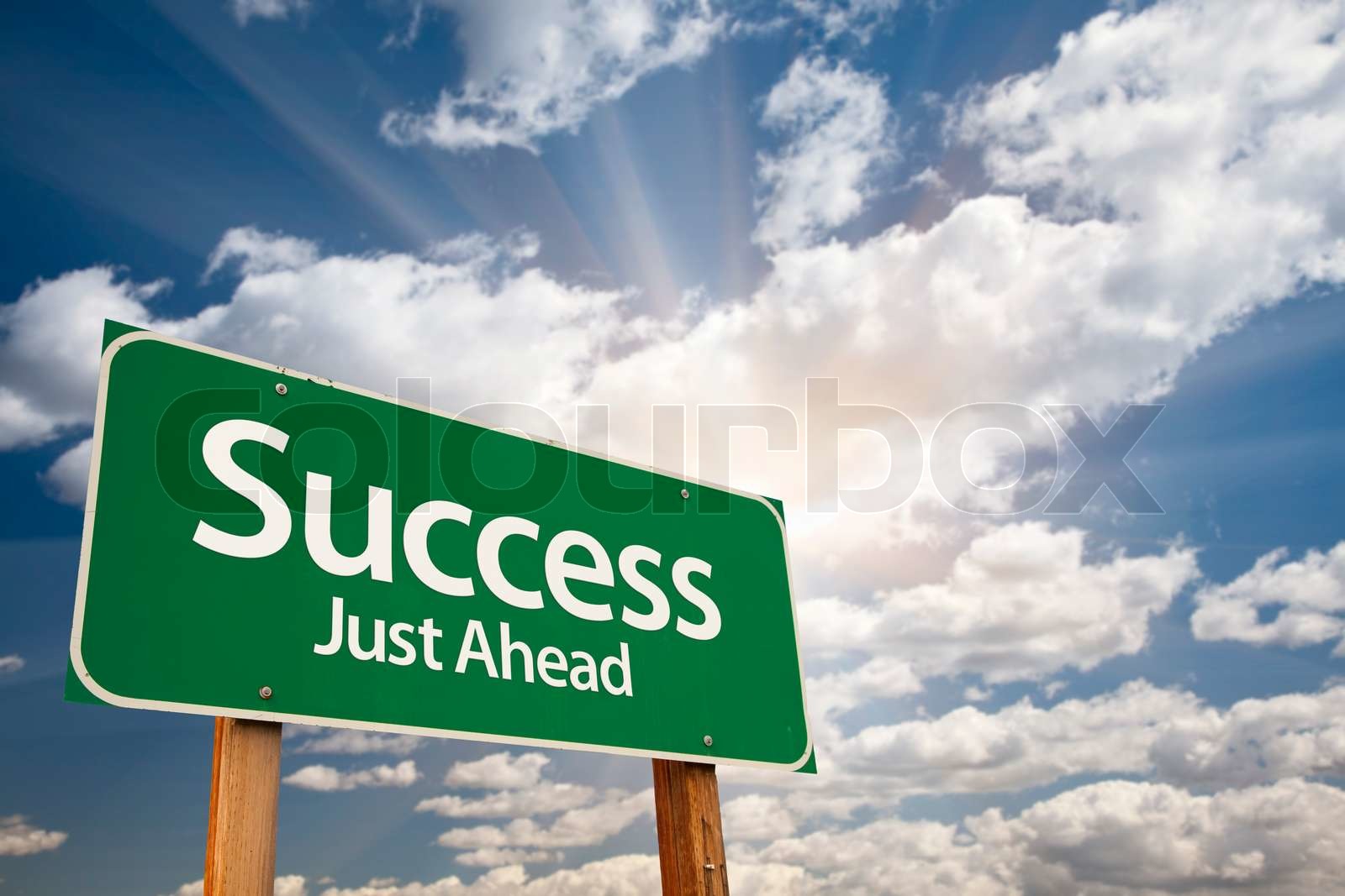 Success Green Road Sign Against Clouds | Stock image | Colourbox