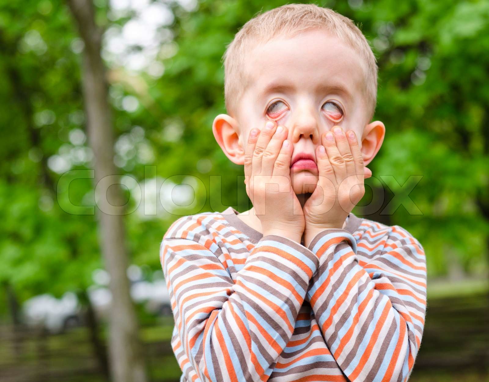 Little boy pulling a scary expression | Stock image | Colourbox