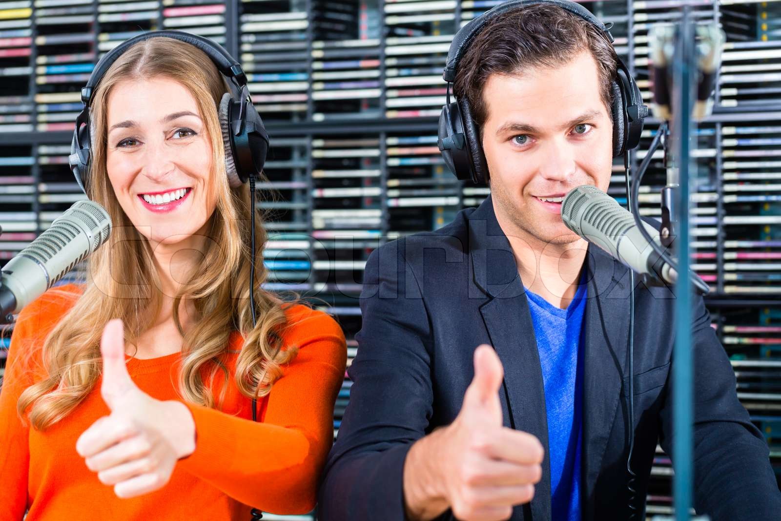 radio presenters in radio station on air | Stock image | Colourbox