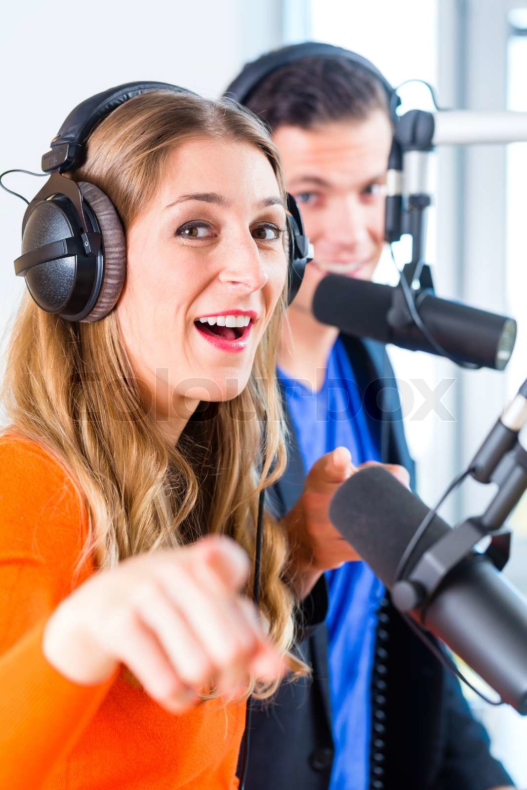 radio presenters in radio station on air | Stock image | Colourbox