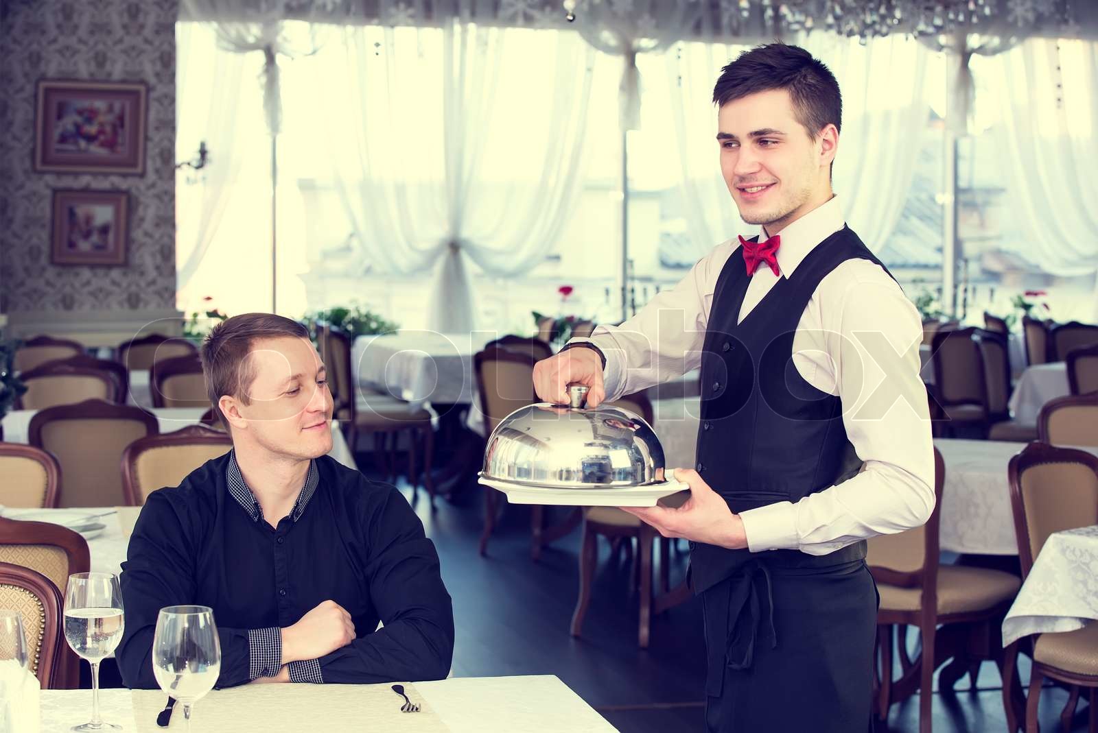 server and client in the restaurant | Stock image | Colourbox
