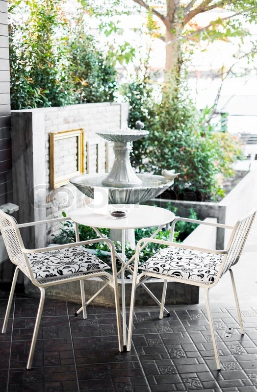 Cozy coffee shop with white chairs and ... | Stock image | Colourbox