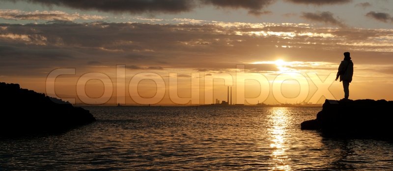 Sunset backlit with human silhouette in ... | Stock Photo | Colourbox
