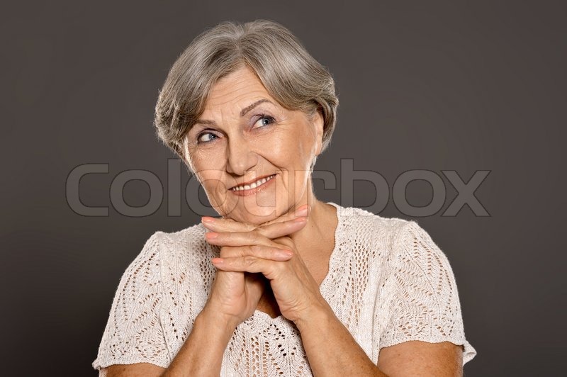 Portrait of thinking elderly woman on ... | Stock Photo | Colourbox
