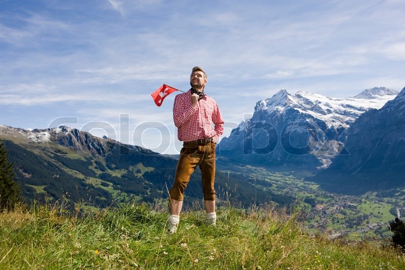 A man holding a Swiss flag | Stock image | Colourbox
