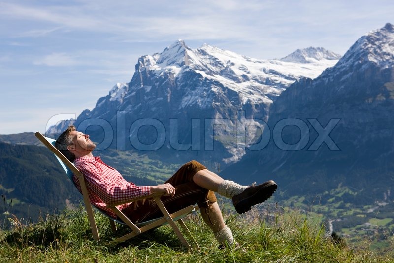 A man in Switzerland enjoys the good ... | Stock image | Colourbox