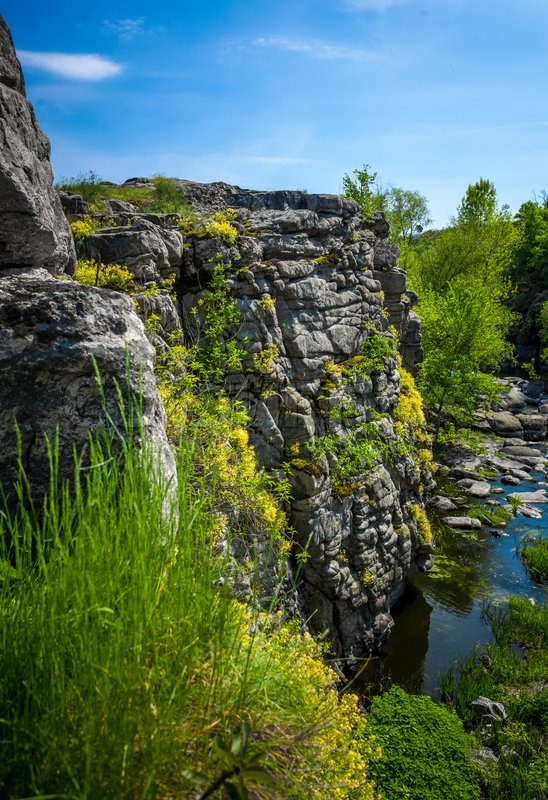 Vertical photo of high cliff on river ... | Stock image | Colourbox