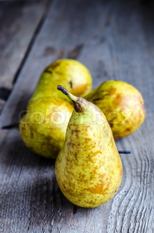 Yellow pears in a row | Stock image | Colourbox