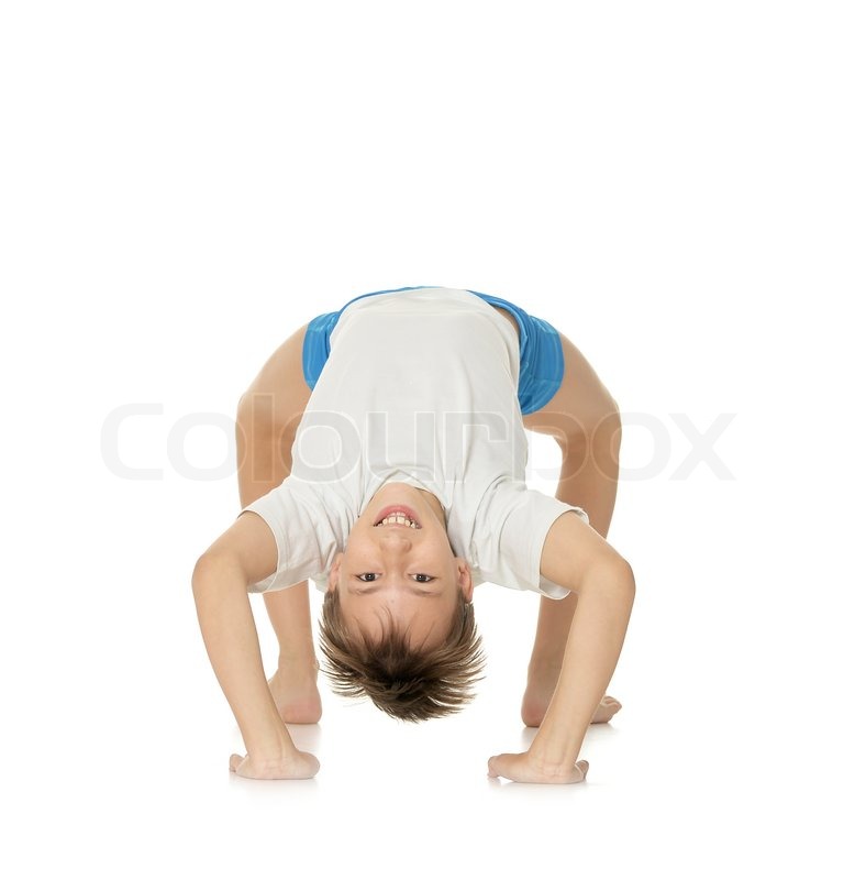 Young boy exercising isolated on white ... | Stock image | Colourbox