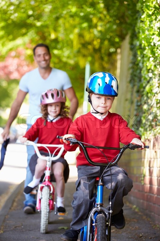 Children Riding Bikes On Their Way To ... | Stock image | Colourbox