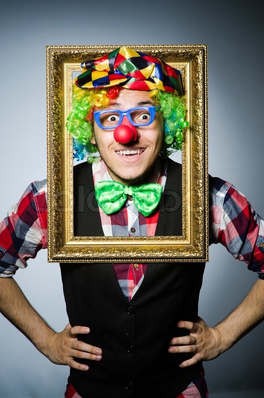 Funny clown with picture frame | Stock image | Colourbox