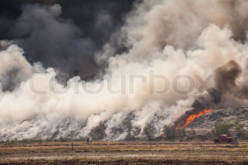 Burning garbage heap of smoke from a ... | Stock image | Colourbox