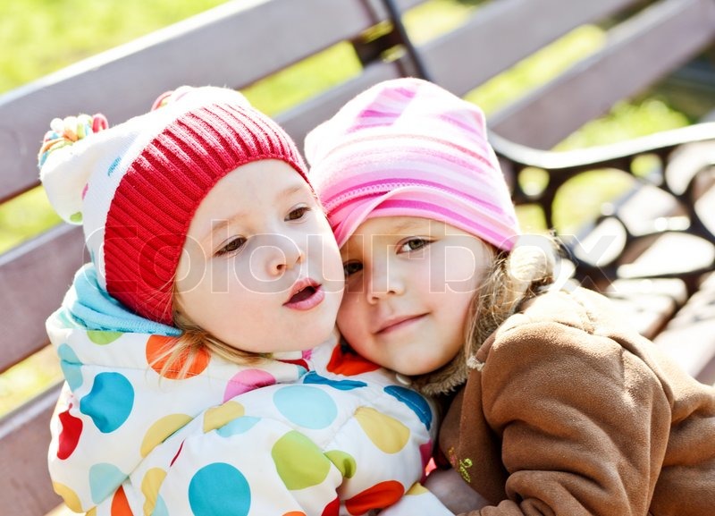 Two toddler friends hugging outdoors | Stock image | Colourbox