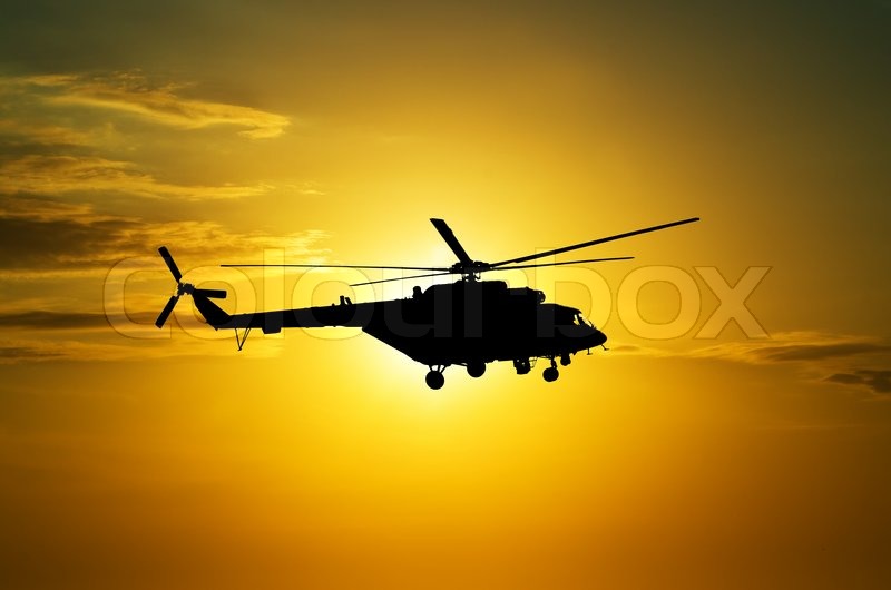 Helicopter at sunset in the sky | Stock image | Colourbox