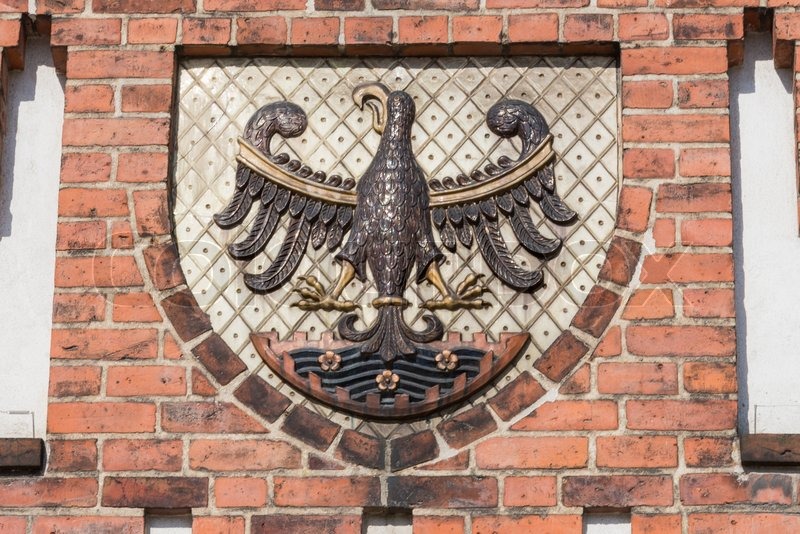 Byvåben for Roskilde Kommune på væg | Stock foto | Colourbox
