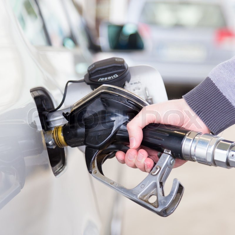 Petrol or gasoline being pumped into a ... | Stock Photo | Colourbox