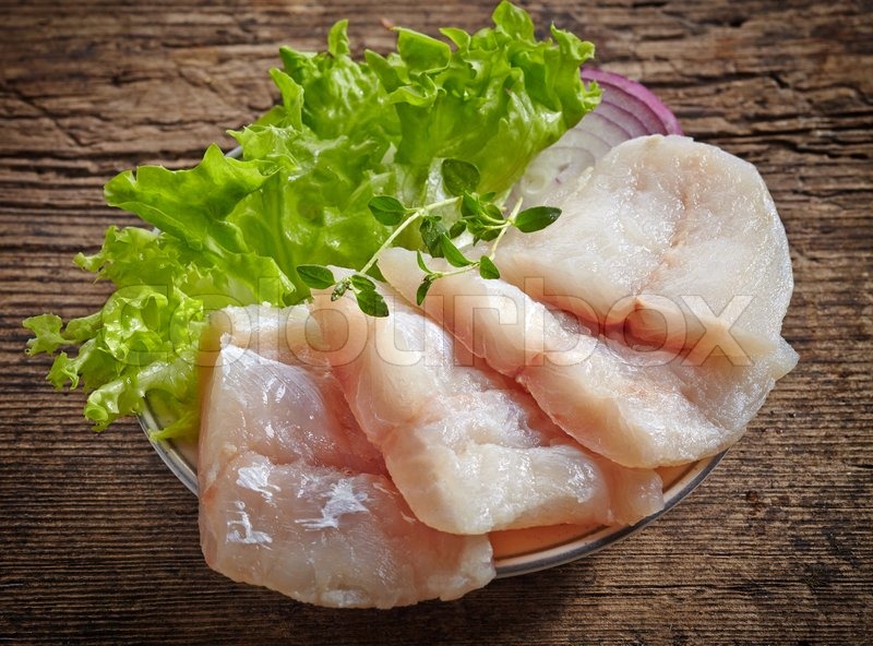 Raw hake fish fillet pieces on dark ... | Stock image | Colourbox