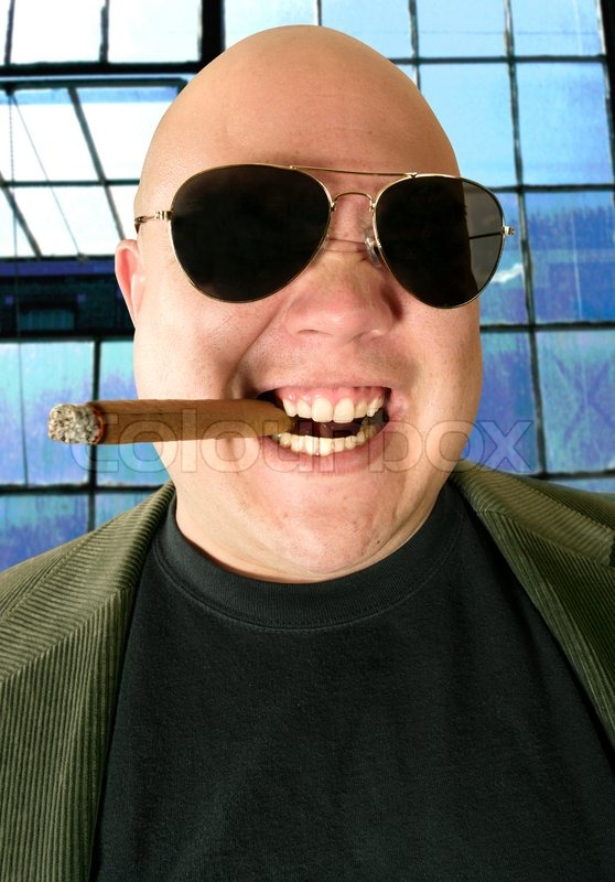 Photo of a cigar smoking gangster in ... | Stock image | Colourbox
