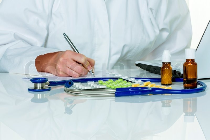 A young doctor prescribes medication. ... | Stock Photo | Colourbox