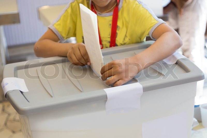 Little boy voting on democratic ... | Stock image | Colourbox