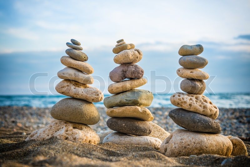 Three stacks of round smooth stones on ... | Stock image | Colourbox
