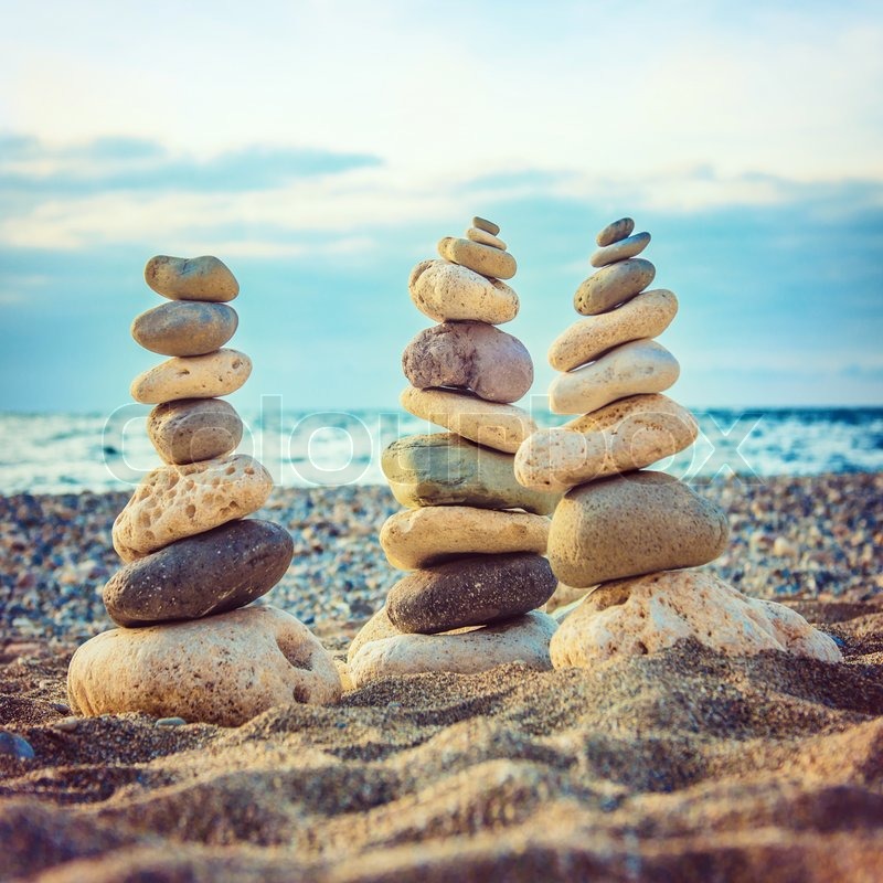 Three stacks of round smooth stones on ... | Stock image | Colourbox