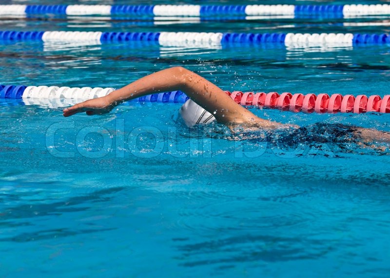 A teenage girl competing in swimming | Stock image | Colourbox