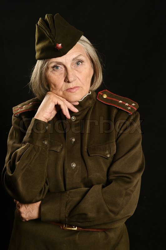 Mature female soldier on a black ... | Stock image | Colourbox