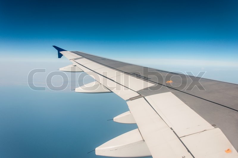 Airplane wing out of window | Stock image | Colourbox